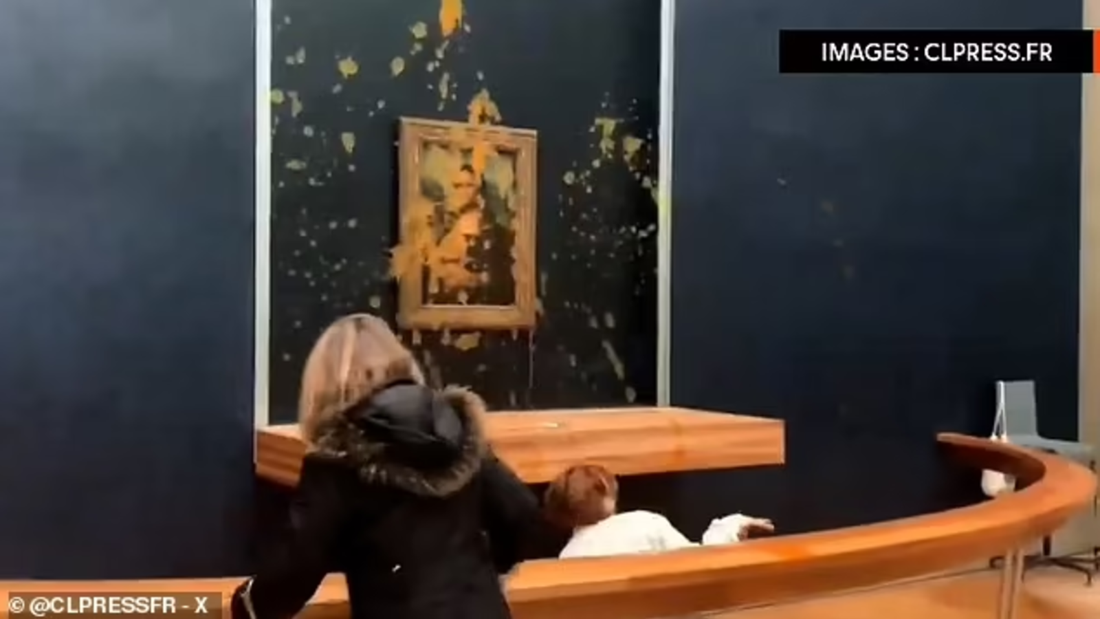 Klima-Aktivisten bewerfen die Mona Lisa mit Suppe - oe24.at Klima-Aktivisten bewerfen die Mona Lisa mit Suppe - oe24.at